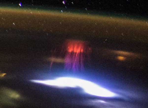 Elusive Red Sprite Seen From the Space Station – Lights in the Dark