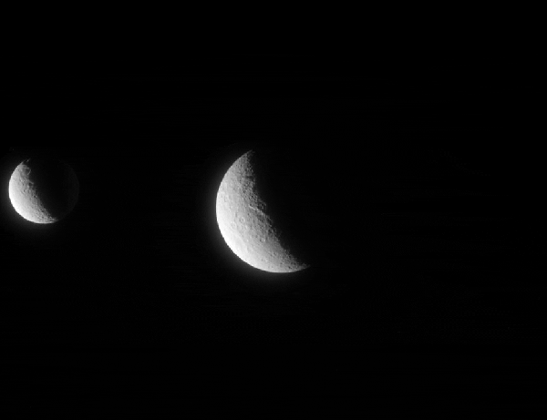 Rhea Eclipses Dione While Cassini Watches – Lights in the Dark