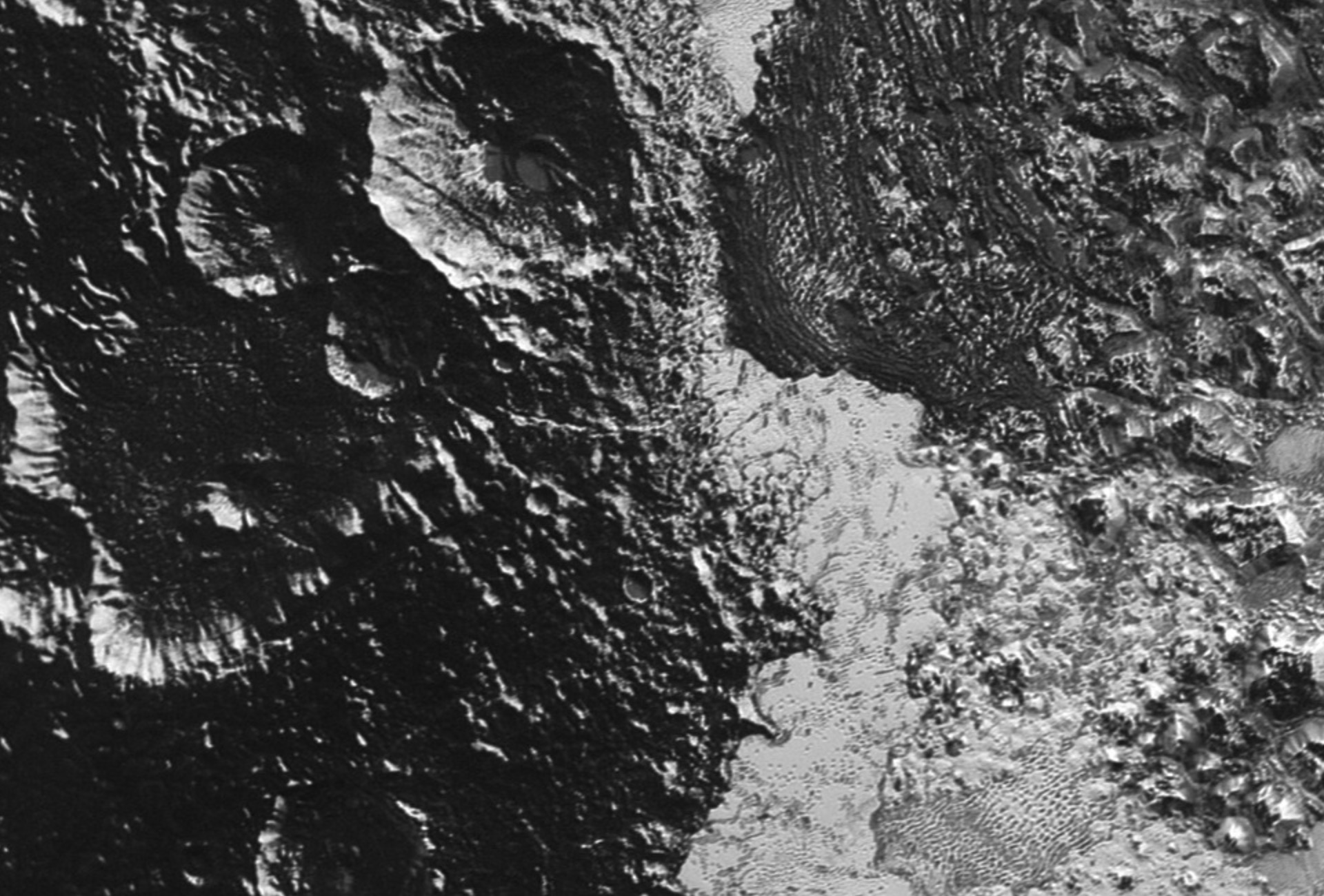 Hear the Call of Cthulhu with New Pics of Pluto – Lights in the Dark